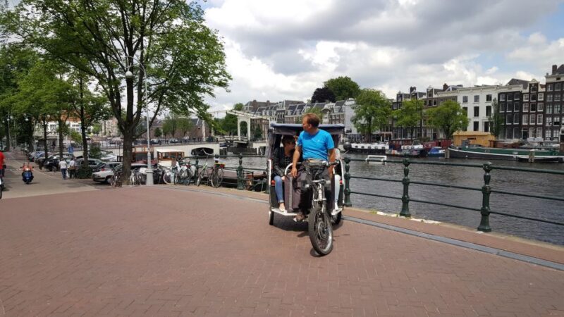 Amsterdam: 2-Hour Sightseeing Tour by Rickshaw - The Sum Up