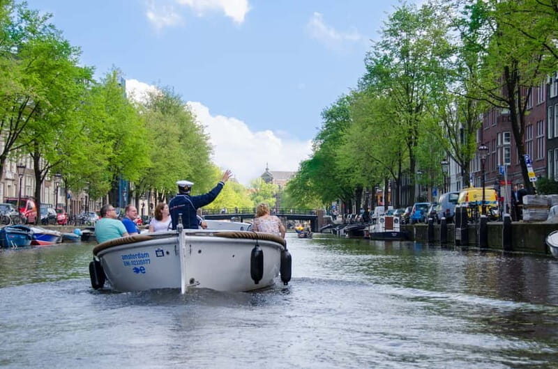 Amsterdam: Guided City Highlights Open Boat Canal Cruise - A Deeper Look at the Experience