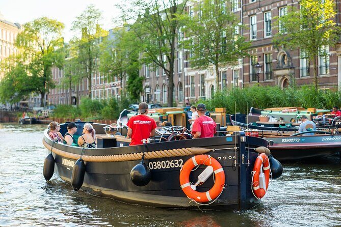 Amsterdam: Guided Open Boat Canal Cruise Unlimited Drinks Option - Who Should Book This Tour?