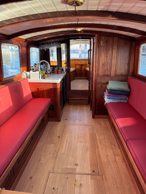 Amsterdam: Historic Boat Cruise with open bar and nibbles - An Authentic Amsterdam Canal Experience