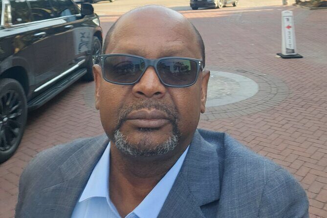 Black SUV Luxury limousines Transportation Services - The Sum Up