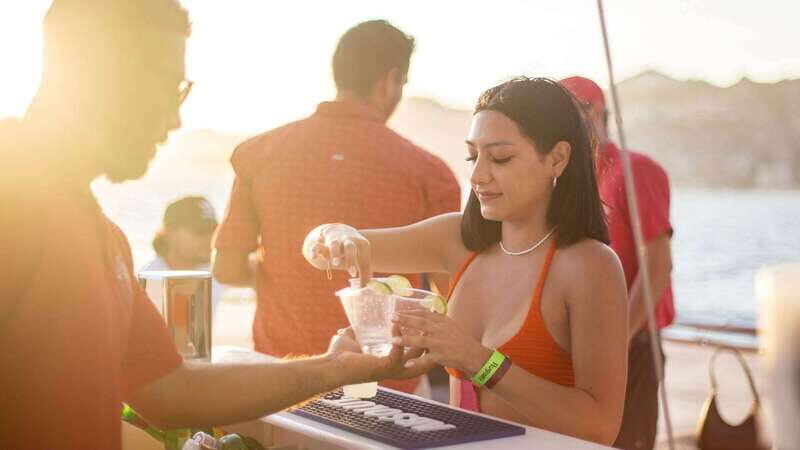 Cabo San Lucas: Sunset Party Cruise with Open Bar - Onboard Experience: Drinks, Snacks, and Music