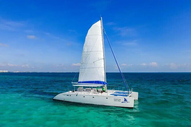 Catamaran to Isla Mujeres Snorkeling, Beach Club and Lunch Tour - The Journey to Isla Mujeres: What to Expect