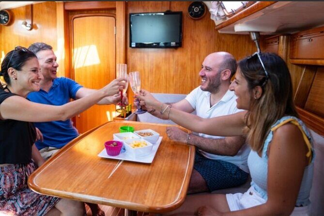 Catania boat tour along the coast with aperitif and snorkeling - The Sum Up