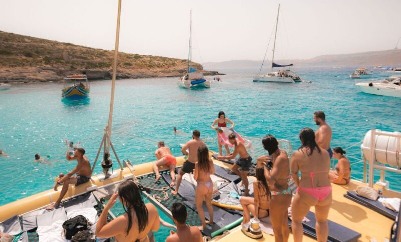 Comino: Blue Lagoon Catamaran Cruise with Lunch and Open Bar - Crew & Atmosphere