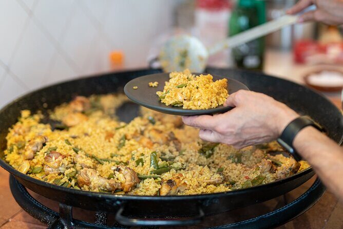 Cook your Paella with Purchase to Russafa Market in Valencia - Key Points