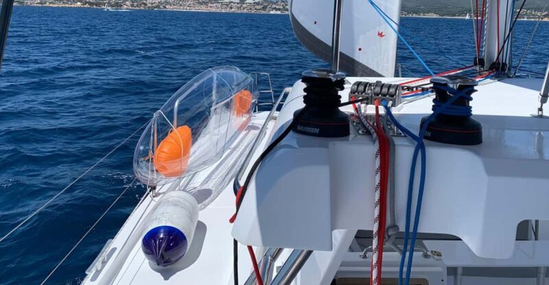 Departure from BRUSC sunset on sailing catamaran - Key Points