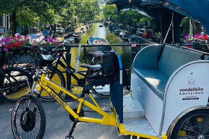 Explore Amsterdam in 75 Minutes Pedicab Rickshaw City tour - Key Points