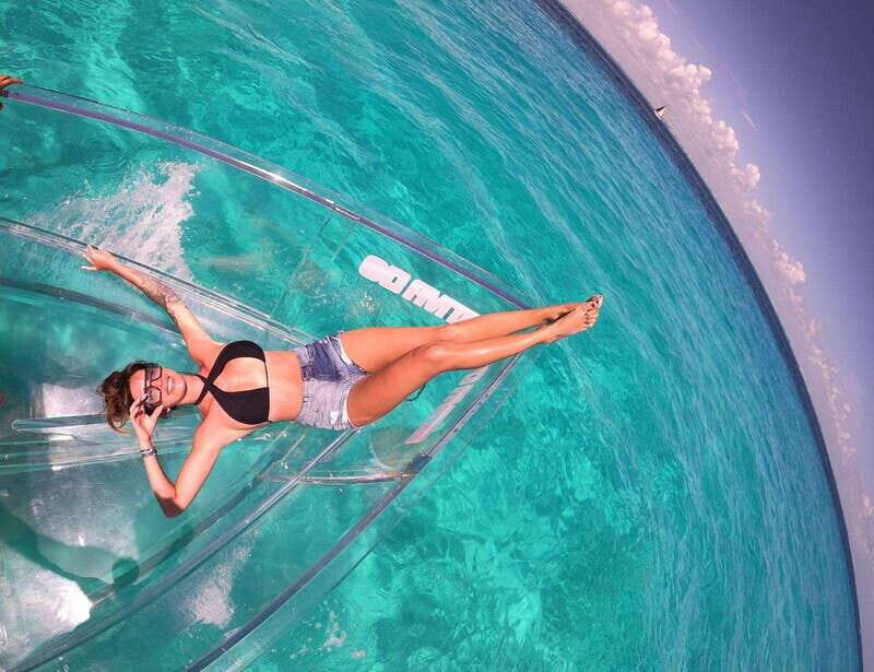 Explore the sea of cozumel in a transprent boat with drinks and snorkel. - FAQ