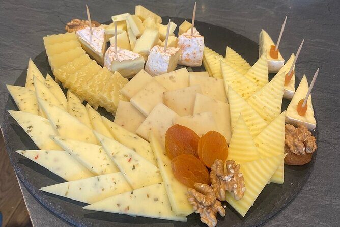 From Basel: Thun Tour, Beatus Caves, Lake Cruise & Cheese - The Charm of Interlaken and a Tasting Experience