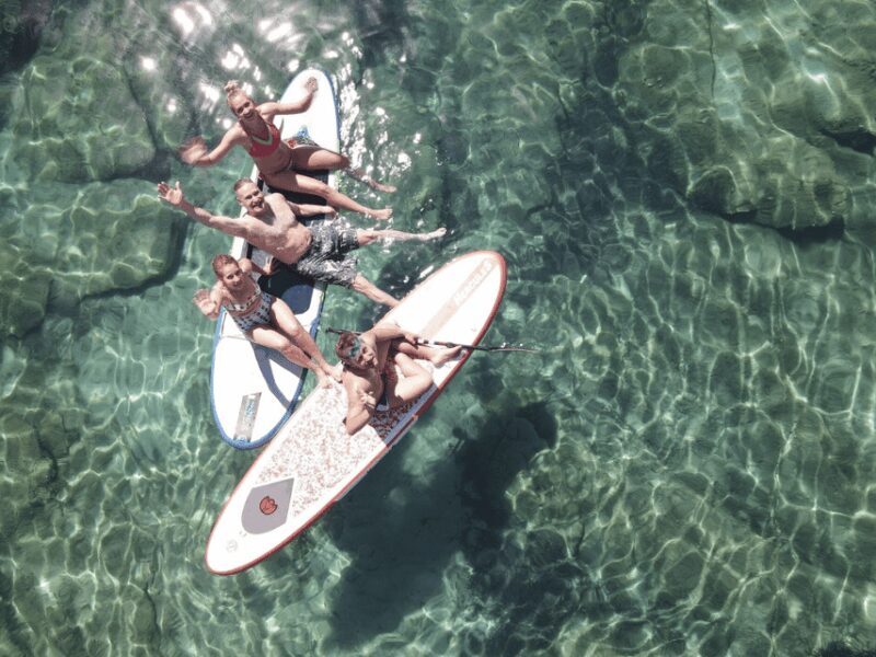 From Ornos: Mykonos Delos Catamaran Cruise with Meal & SUP - The Highlight: Rhenia Island Stop