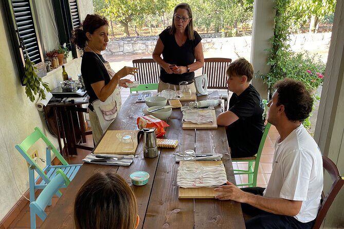 Hands in dough between orecchiette and focaccia in nature - Key Points