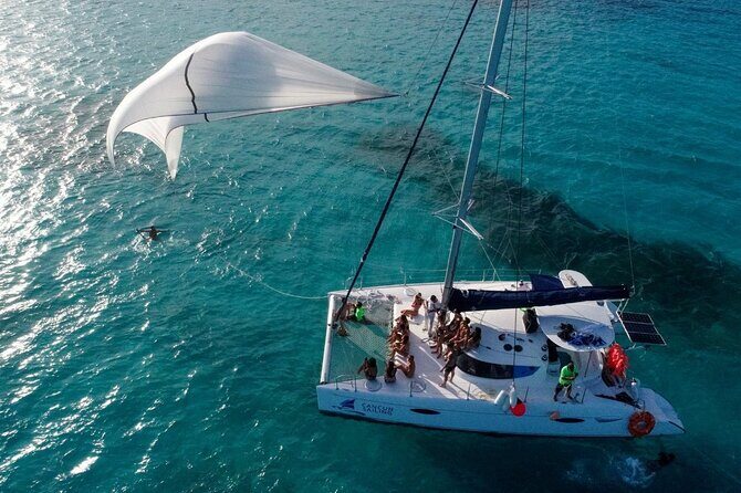 Isla Mujeres Tour on Catamaran with Snorkel, Open Bar, Buffet & Beach club - The Sailing Experience: A Scenic Caribbean Cruise