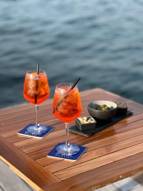 Italian aperitif at the sunset by the sea - A Closer Look at the Experience