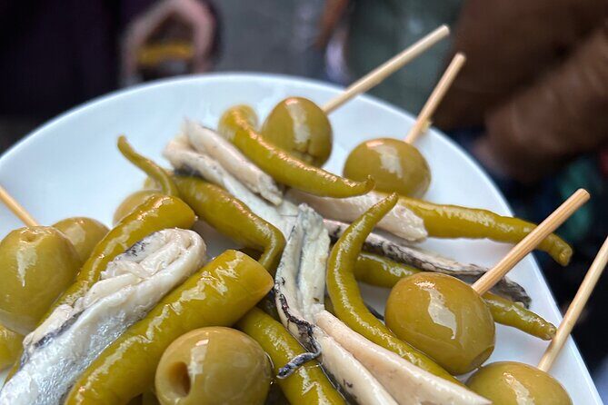 Madrid Local Tapas Tour with Private Dinner and Bottomless Wine - Key Points