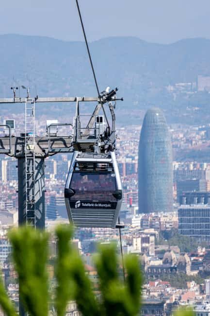 Panoramic Barcelona: Montjuïc, Cable Car, and Beach - Beach Walk and Mediterranean Atmosphere