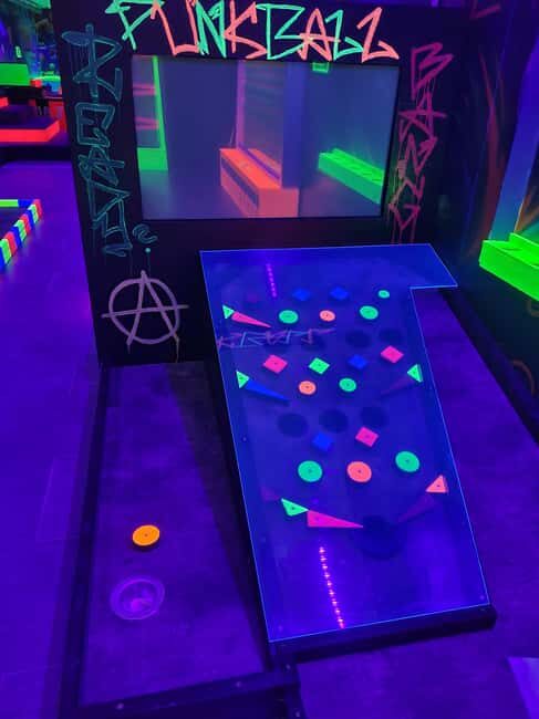 Prague: Punk Minigolf Glow-in-the-Dark Entry Ticket - The Value of $15 in Prague’s Glow-in-the-Dark Minigolf