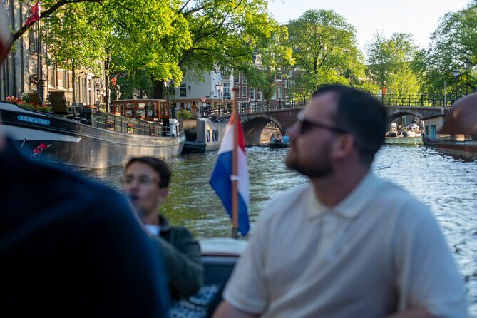 Private Boat Tour Amsterdam - 90 Min incl. welcome drink on historic saloon boat - The Guides: Knowledge and Hospitality