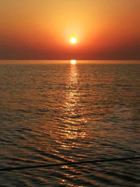 Rhodes: Sunset Catamaran Cruise with Snack, Fruits & Drinks - Key Points