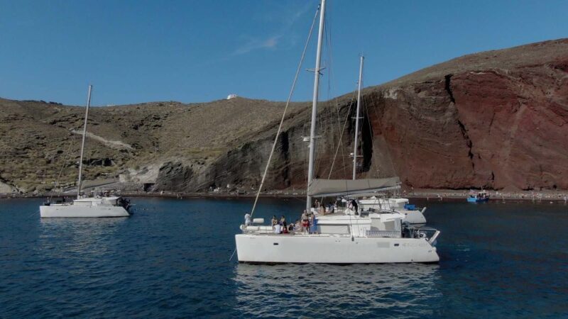 Santorini: Sunset Cruise with Greek Dinner and Transfer - The Experience of Swimming and Snorkeling