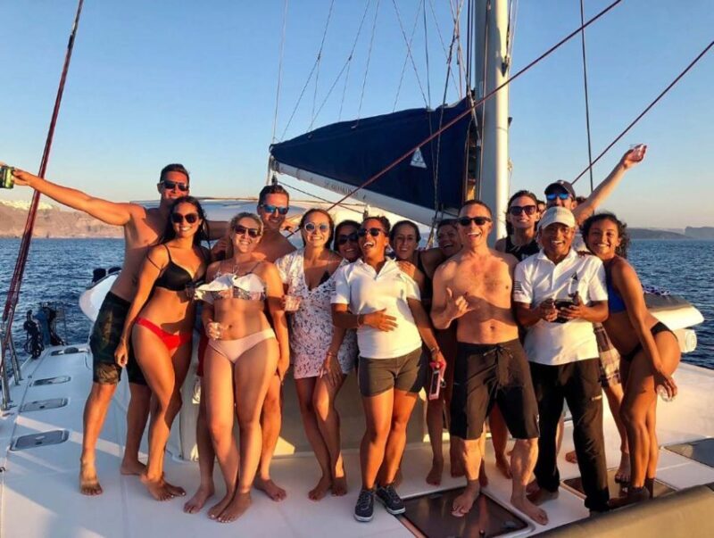 Santorini: Sunset Cruise with Greek Dinner and Transfer - Sunset Viewing and Photography Tips