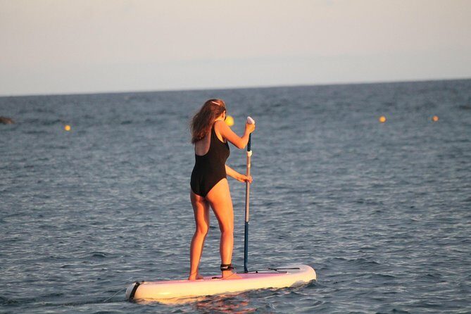 sunset stand up paddle - The Sum Up