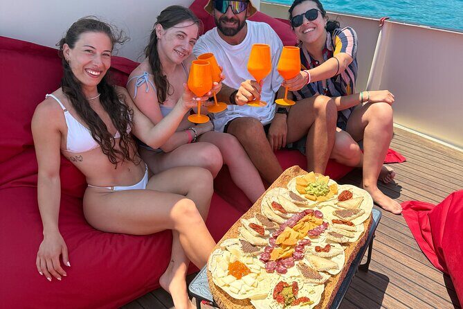 Sunset with dolphins on a vintage tugboat in Golfo Aranci - Who Would Love This Experience?