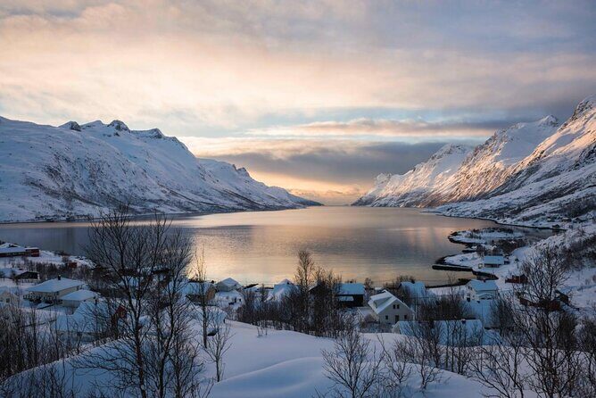 Tromso fjords road trip with fire in grill cabin by the beach. - Key Points